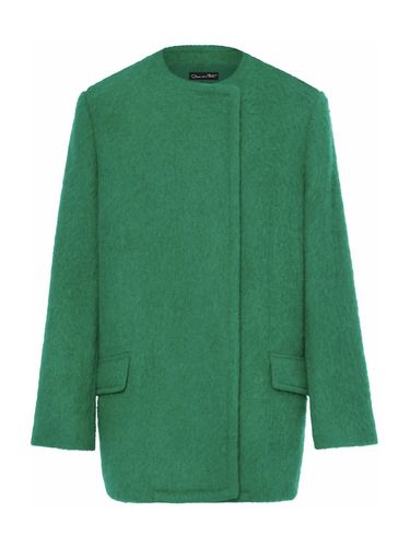 How to wear a green coat and the best green coats to buy - Vogue ...