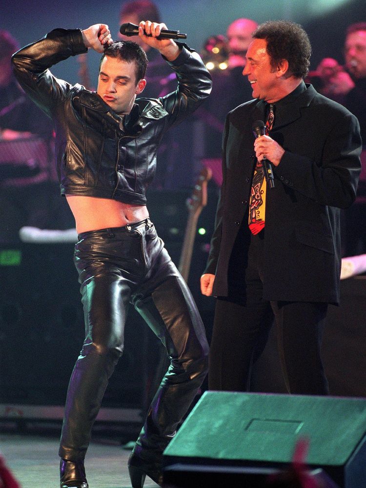 12 throwback Robbie Williams looks that prove he’s a low-key fashion ...