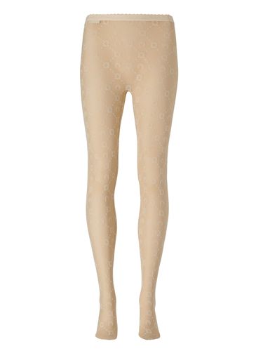 How to style the hottest accessory of the season: Stockings - Vogue ...