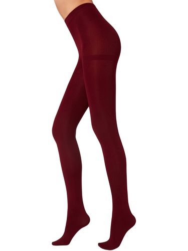 How to wear the red stockings trend this Valentine's Day - Vogue ...