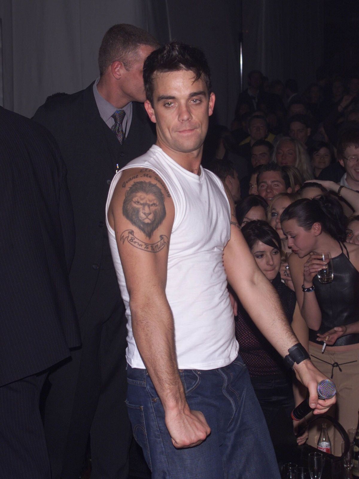 12 throwback Robbie Williams looks that prove he’s a low-key fashion ...