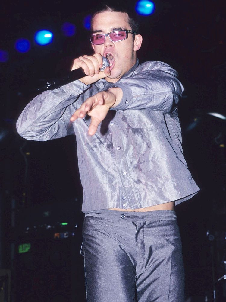 12 throwback Robbie Williams looks that prove he’s a low-key fashion ...